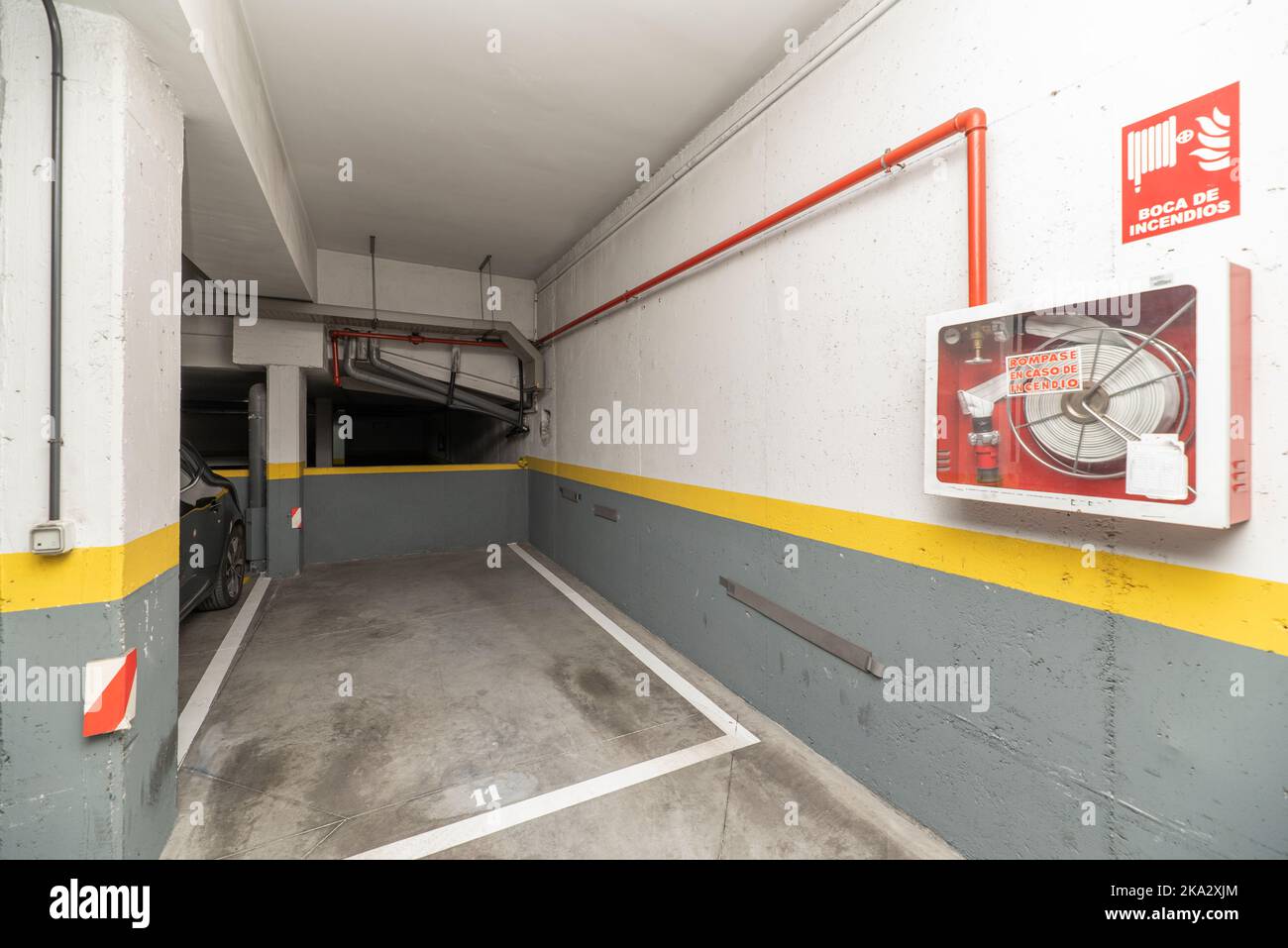 Garage space on the ground floor of a residential building with a fire ...