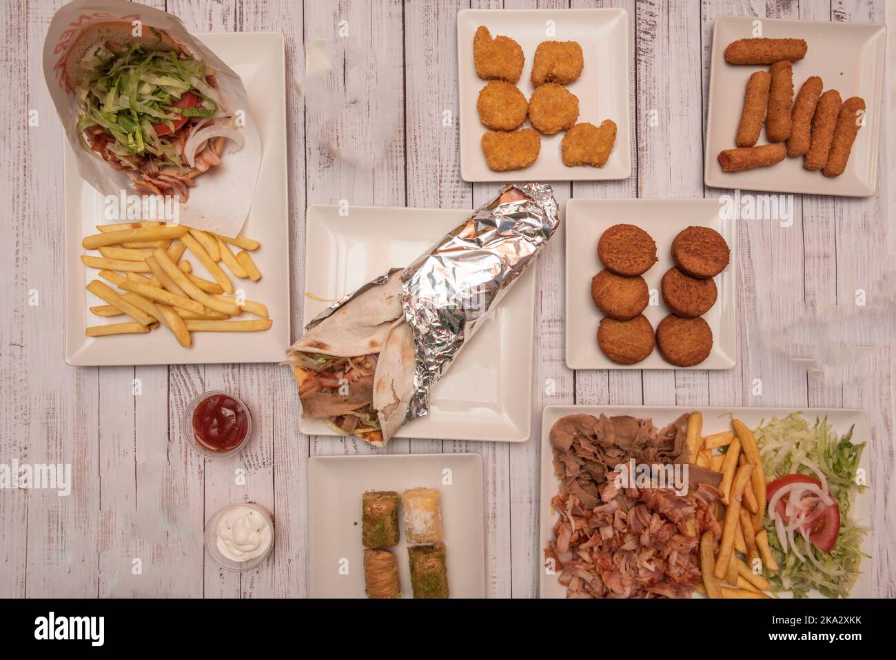 set of kebab food dishes with french fries, falafel, fried nuggets ...