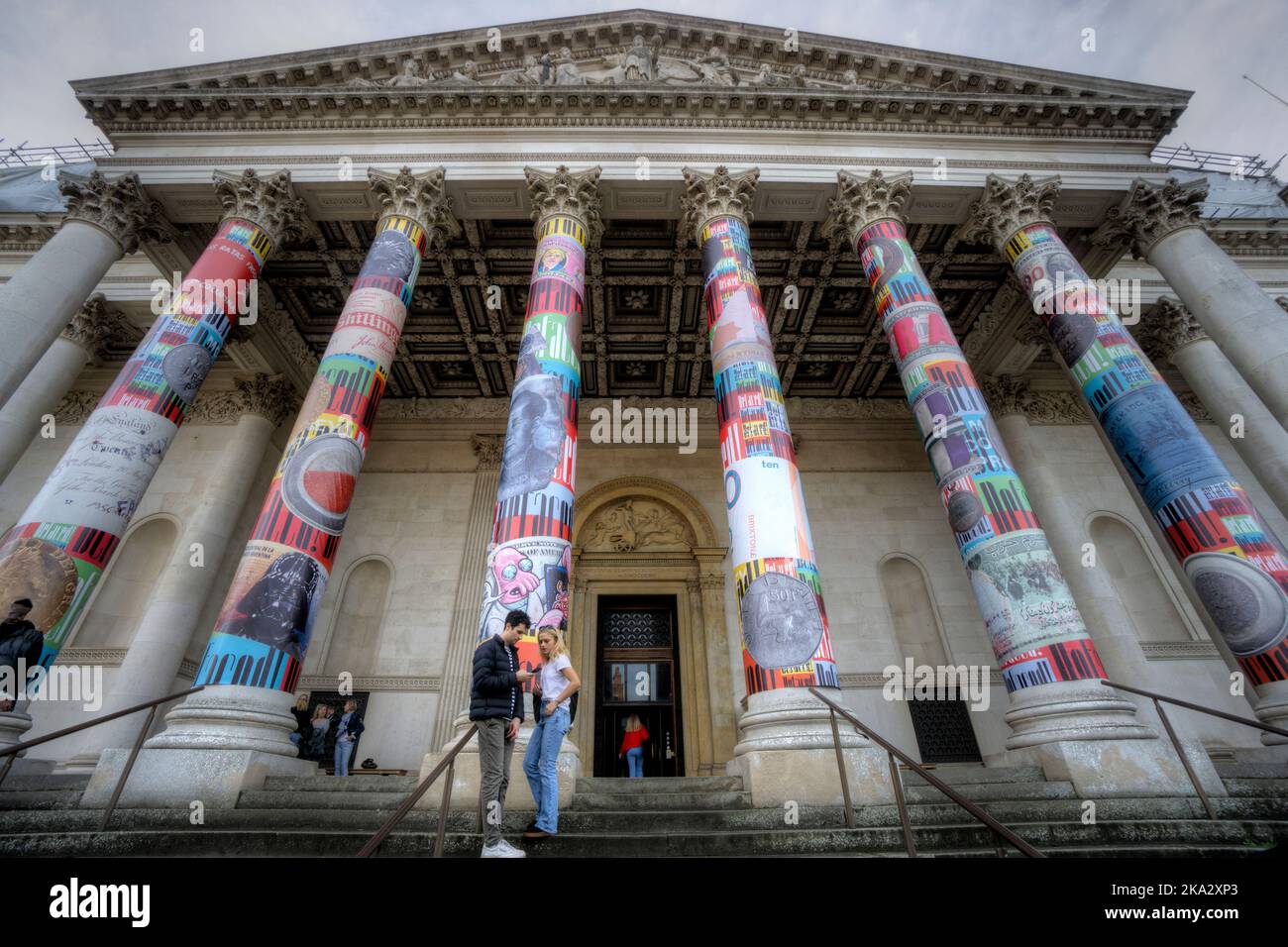 Young male and female couple on steps of fitzwilliam museum cambridge ...