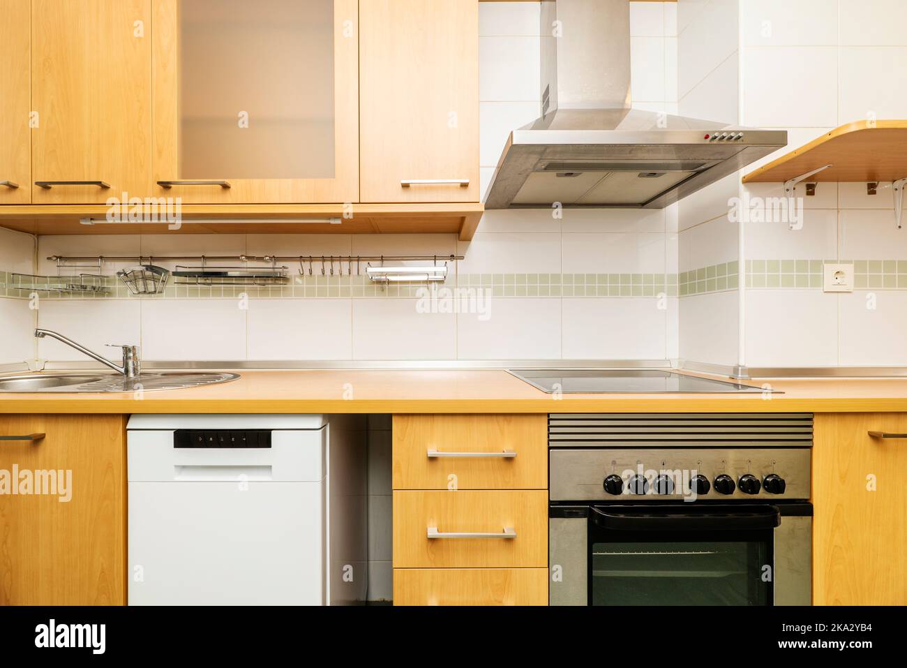 Front view of a kitchen with cherry cabinets and countertops and built ...