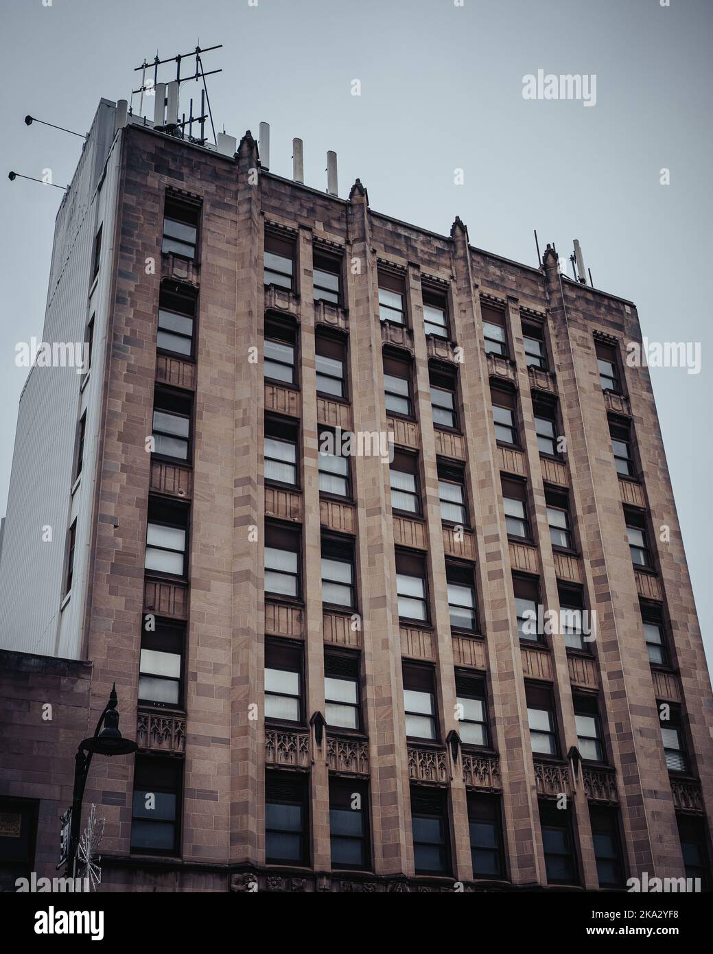 A low angle stone skyscraper in an old style Stock Photo - Alamy