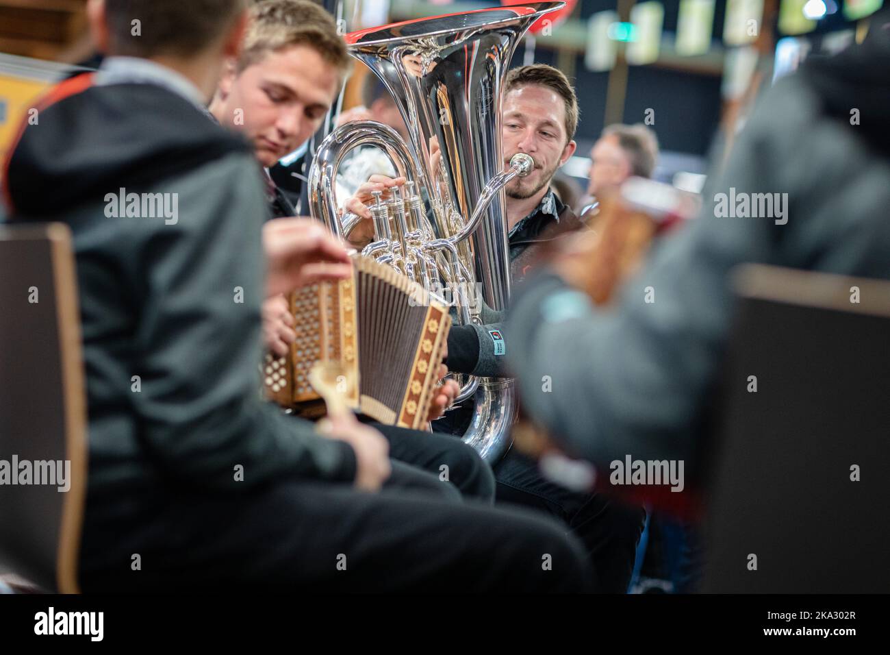A shallow focus shot of musicians tuning their classical instruments ...