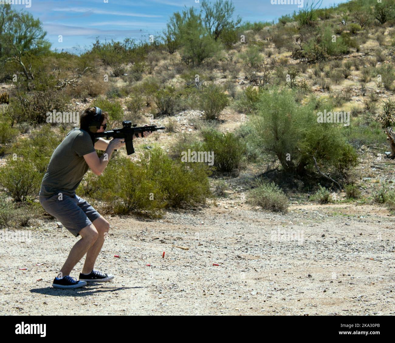 Caucasian man shooting a AR15 Pistol using 5.56mm ammo in Arizona ...