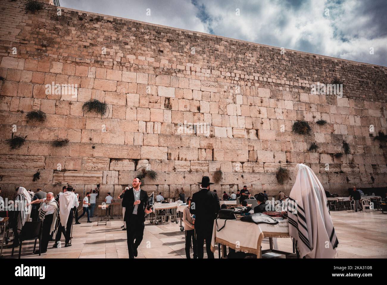 The praying men at the Western Wall in Jerusalem, Israel Stock Photo ...