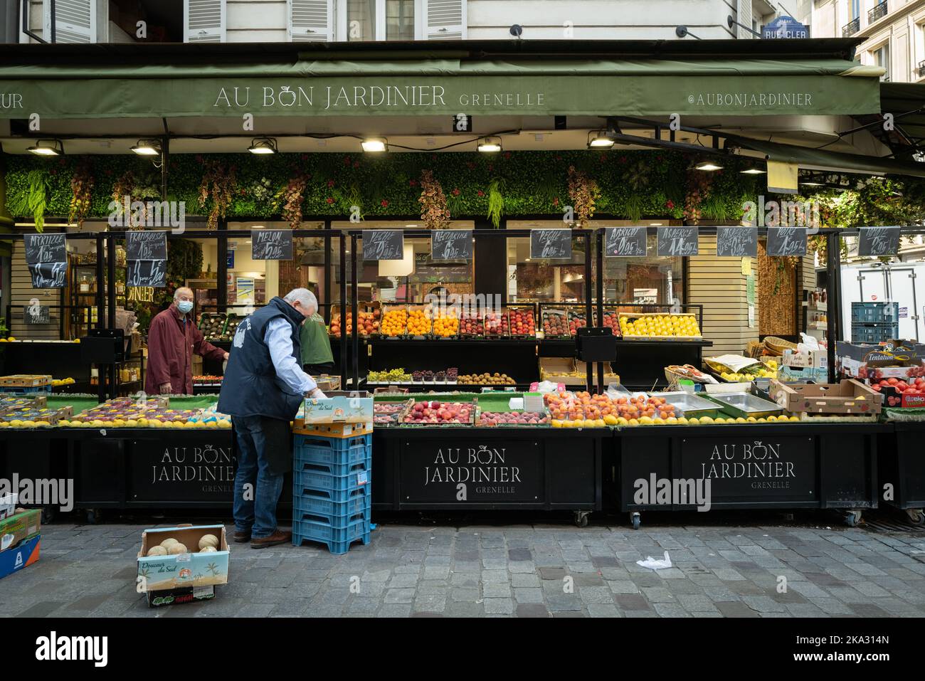 An outdoor grocery store in Paris. People at the street market Stock ...