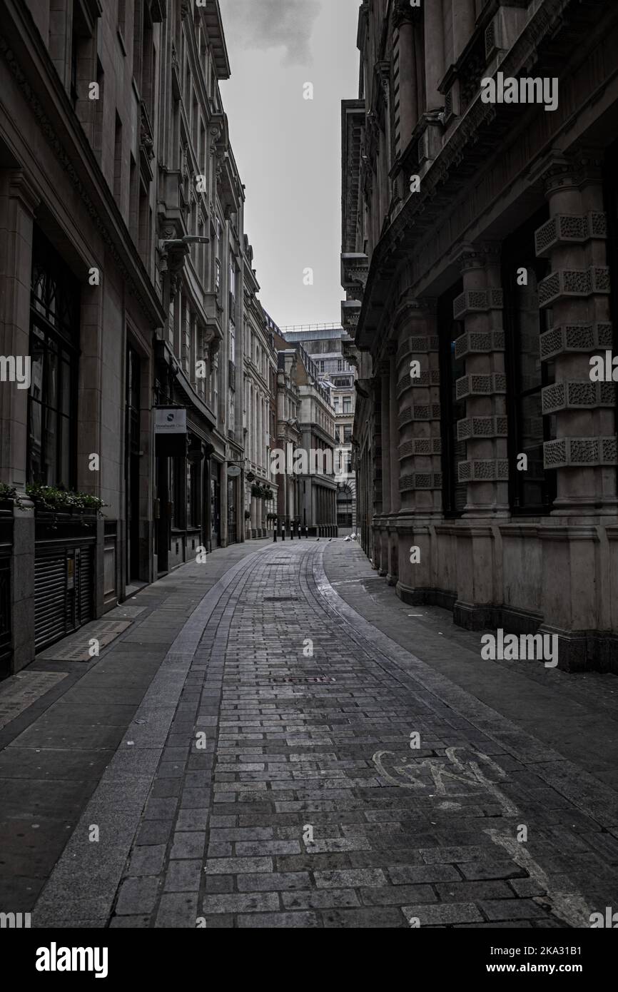 A vertical view of an alleyway with old architecture in the city of ...