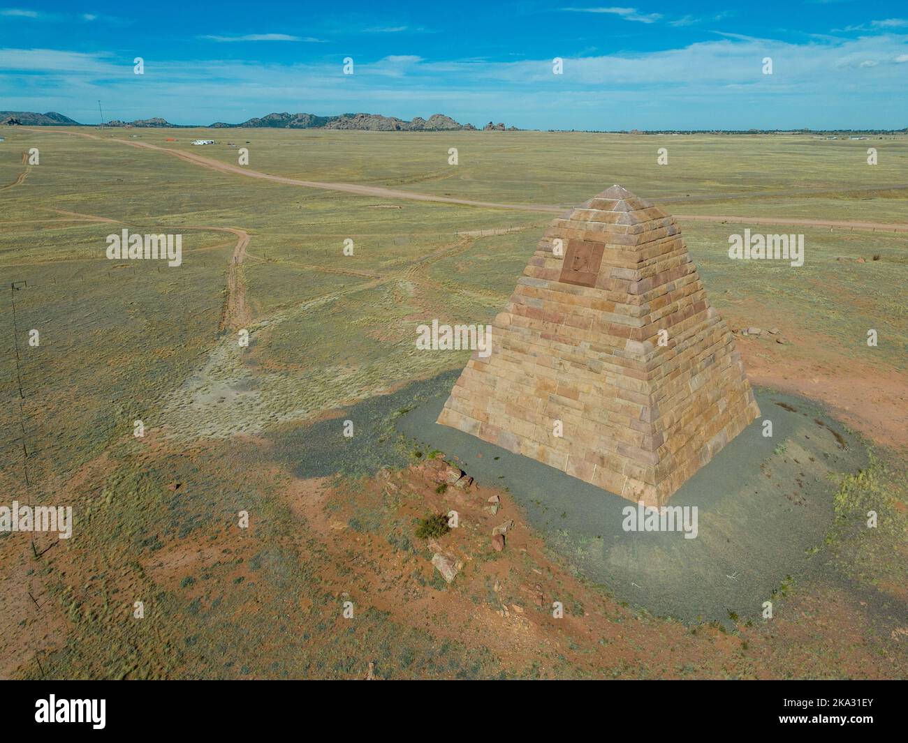 A top view of Ames Monument in the middle of the field under blue sky ...