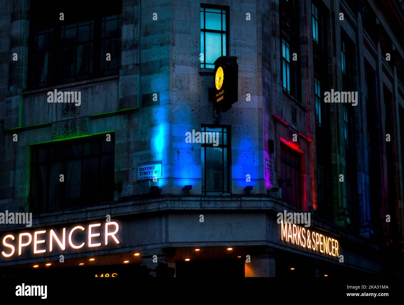 The view of the "Marks and Spencer" sign on a building at night in ...
