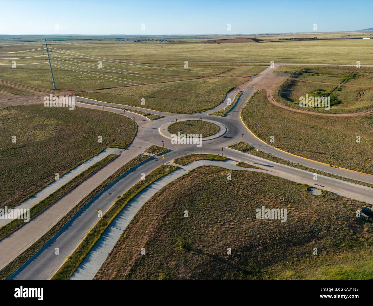 An aerial drone view of roundabout intersection in new development in ...