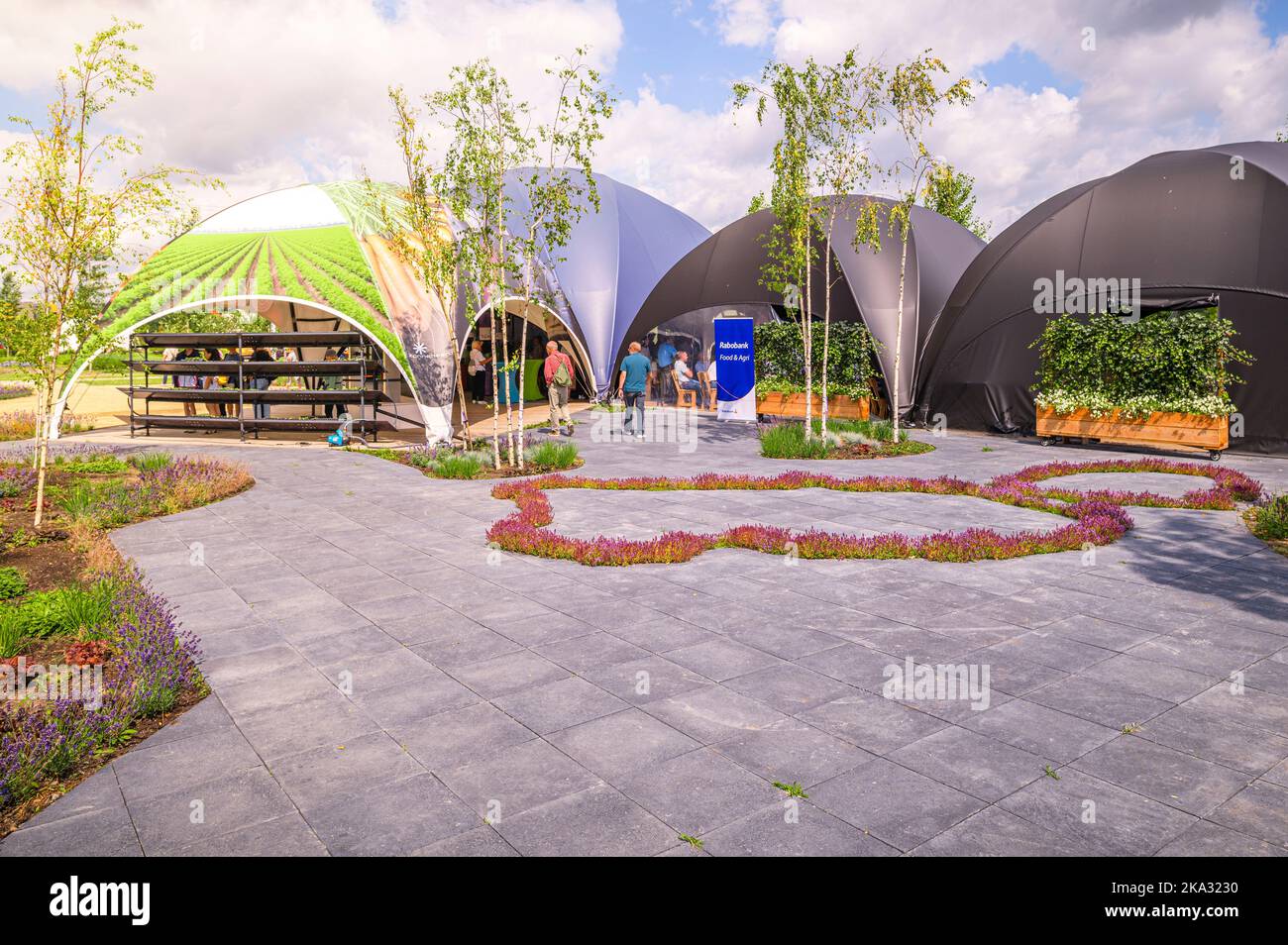 A beautiful shot of people taking interest in the Floriade Expo at ...