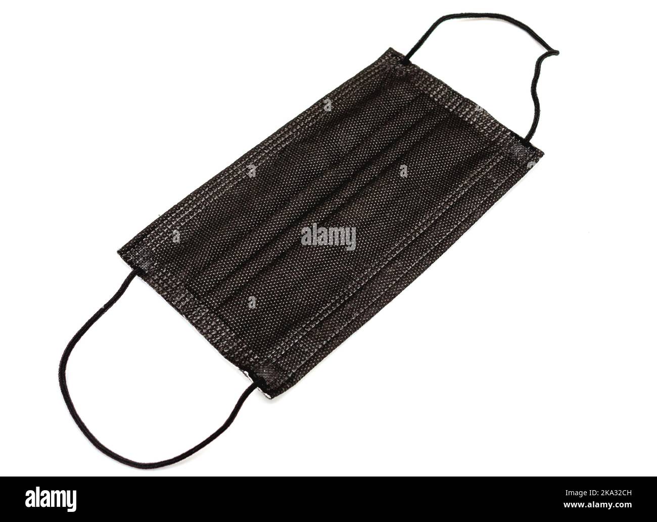 A black protective face mask isolated on white background Stock Photo ...