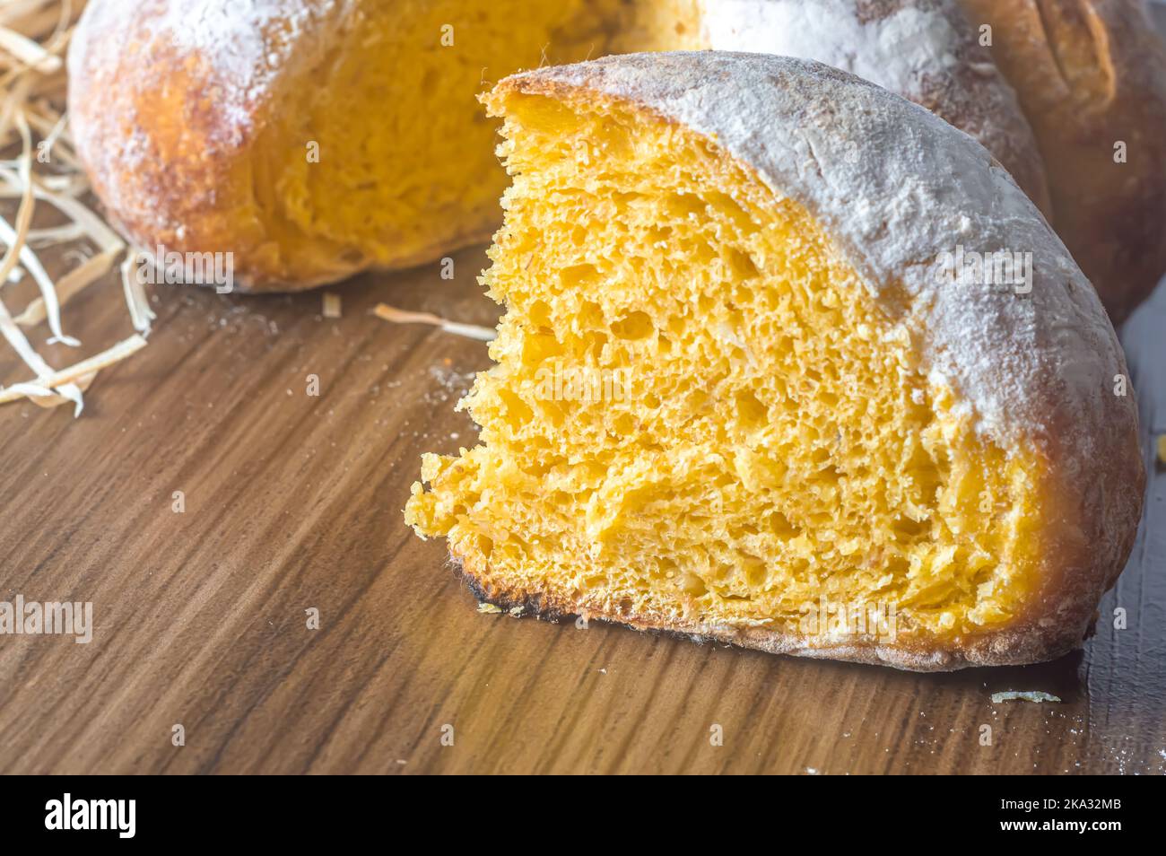 Pumpkin bread made in the shape of a pumpkin on a wooden table Stock ...