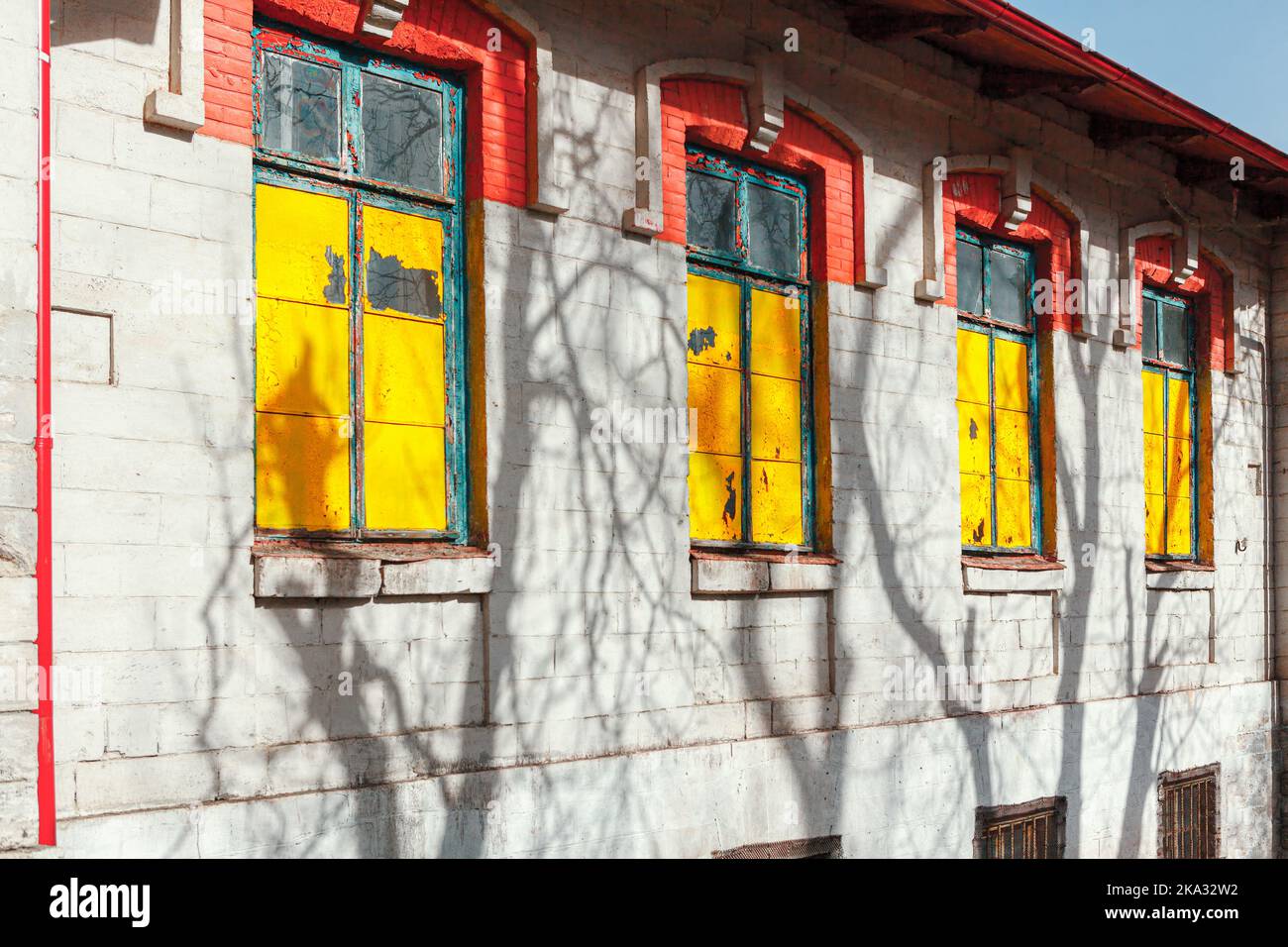 Abandoned architecture , old house with painted windows Stock Photo - Alamy