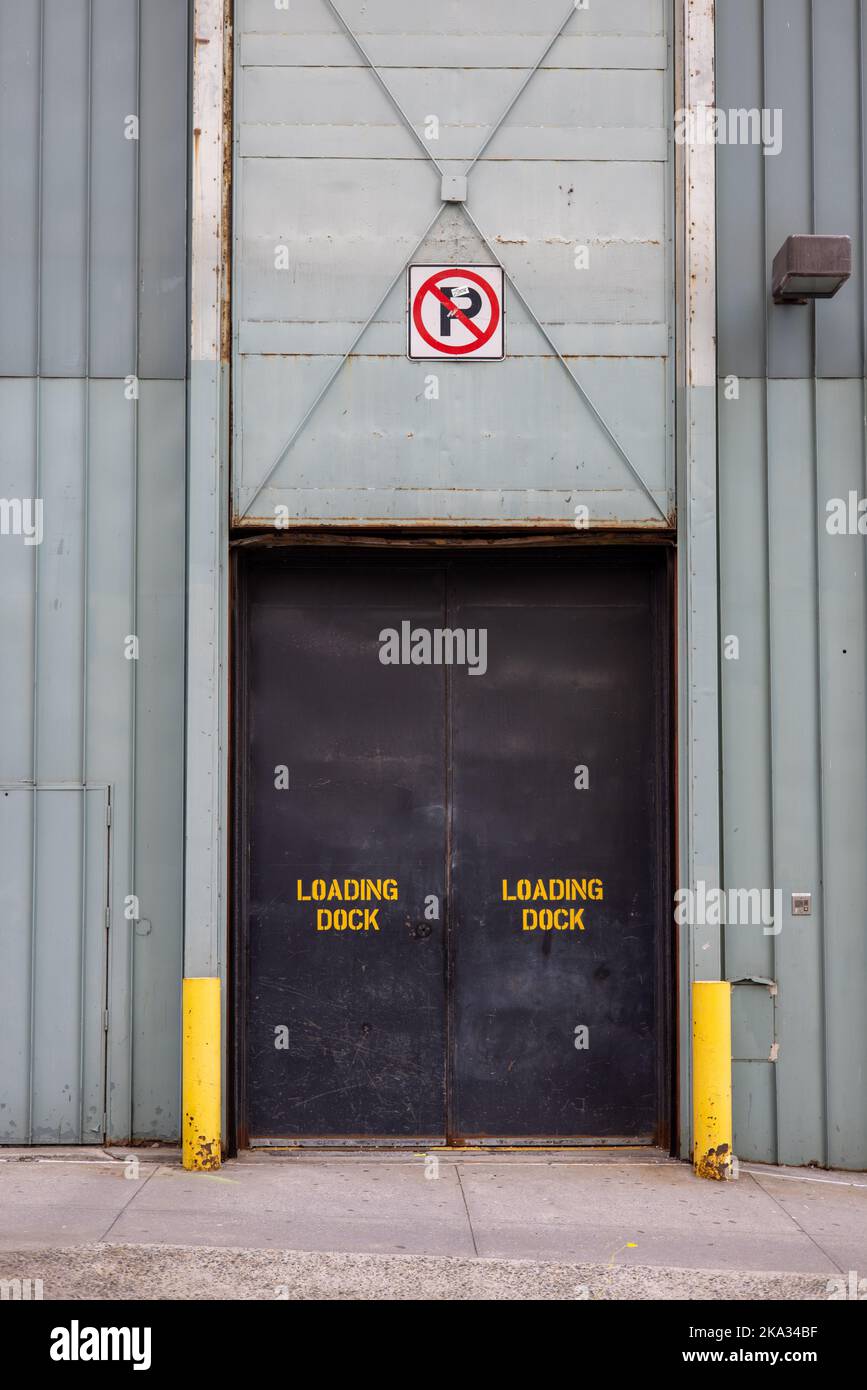 A loading dock for deliveries with a "No parking" sign Stock Photo - Alamy
