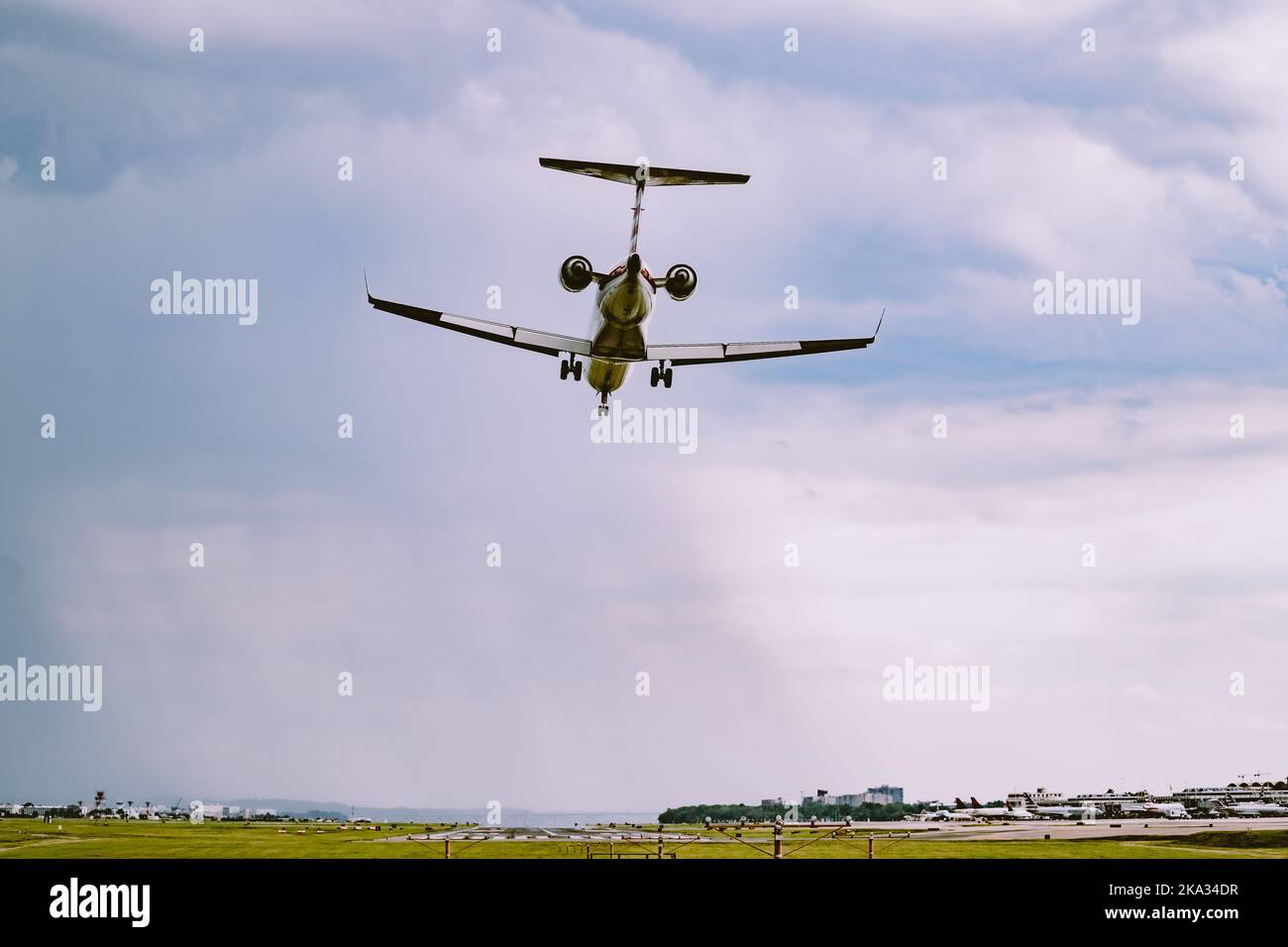 An airplane preparing for landing at the airport Stock Photo - Alamy