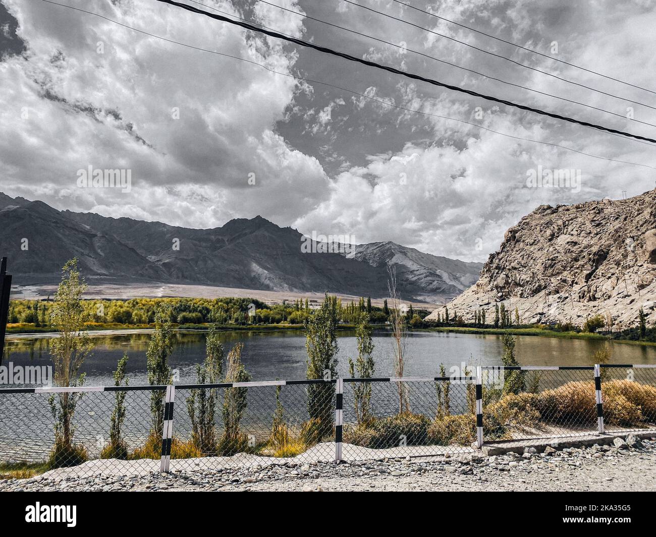 A low angle shot of a beautiful lake near the mountains Stock Photo - Alamy