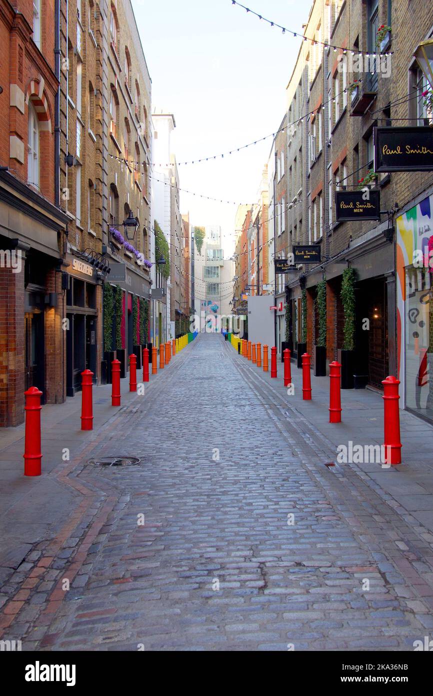 A pride bollards Rainbow street and a sidewalk lined with protecting ...