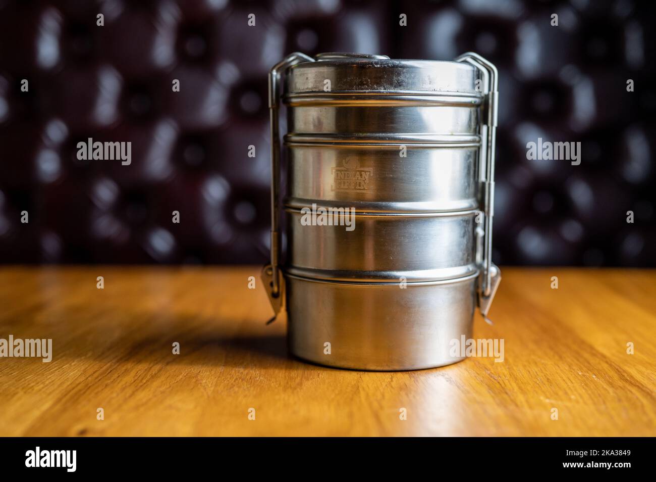 A Tiffin box in an indian restaurant. Food conbtainers to provide a ...