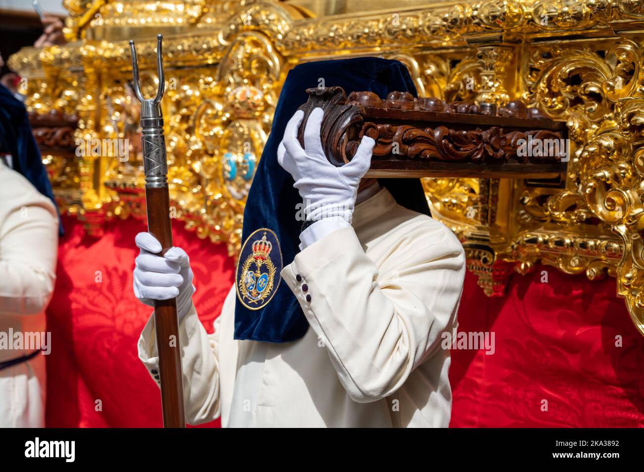 People wearing brightly coloured traditional clothes take part in an ...