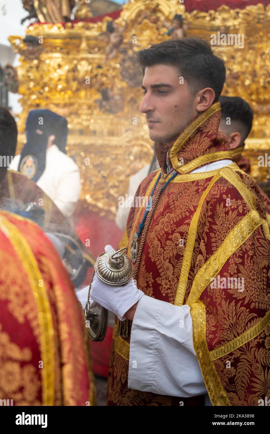 People wearing brightly coloured traditional clothes take part in an ...
