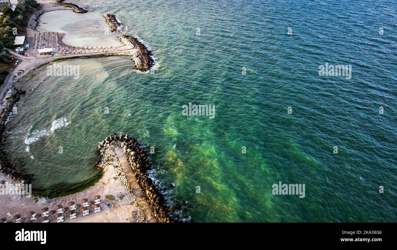 An aerial view of a beach with benches Stock Photo - Alamy