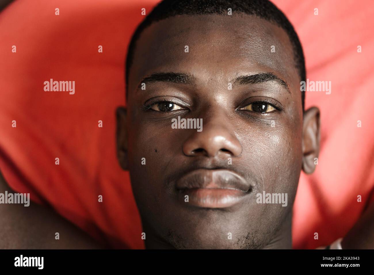 Black man drinking red hi-res stock photography and images - Alamy