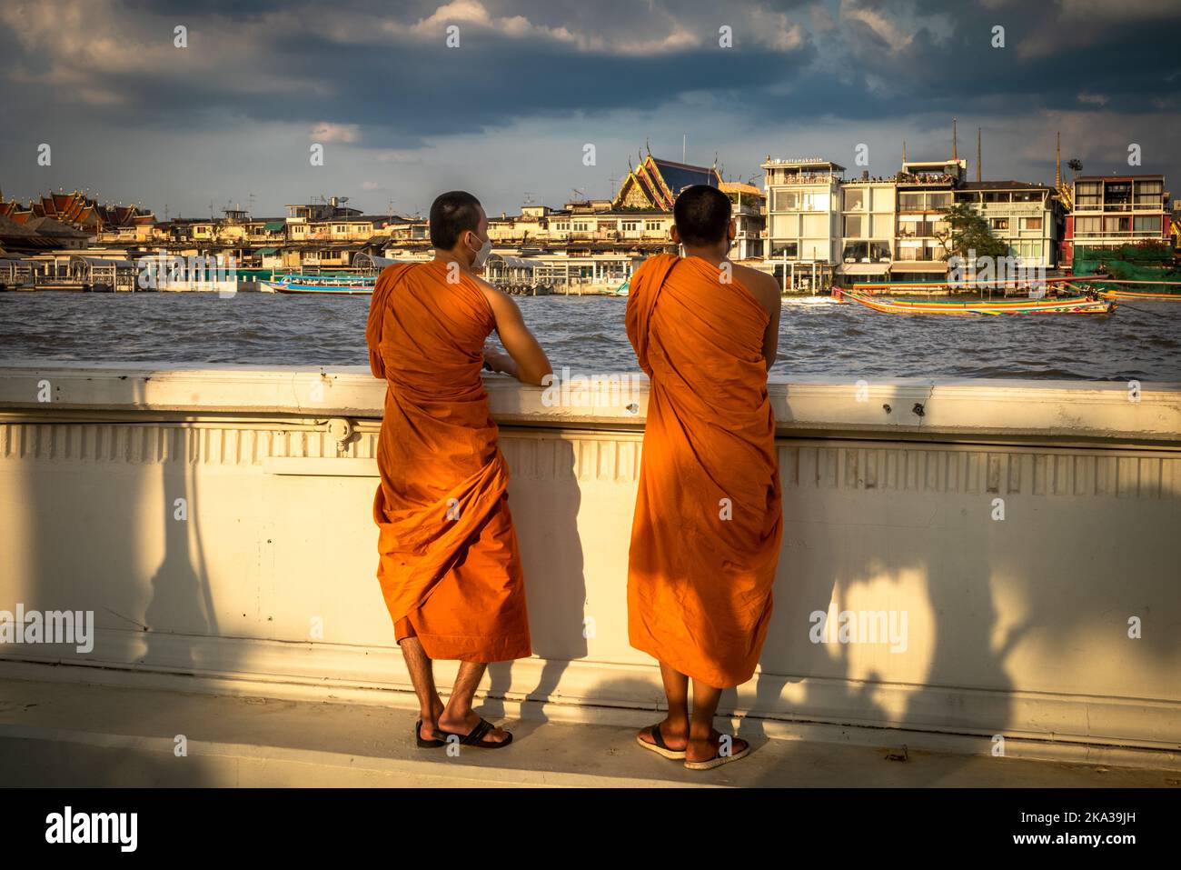 Two monks at the Wat Arun, or the Temple of Dawn, in Bangkok, Thailand ...