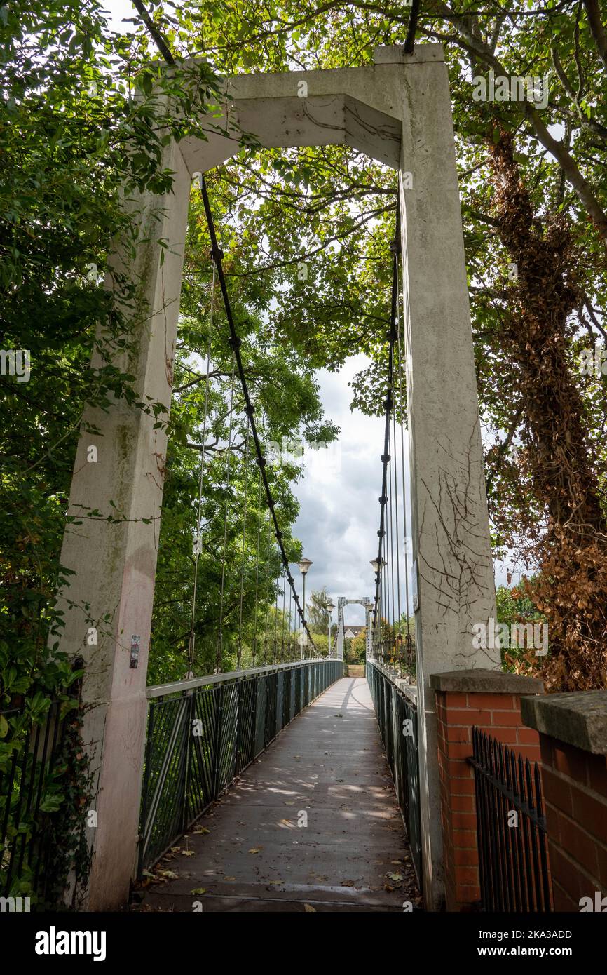 view across Trews Weir Suspension Bridge across the Exeter Ship Canal ...