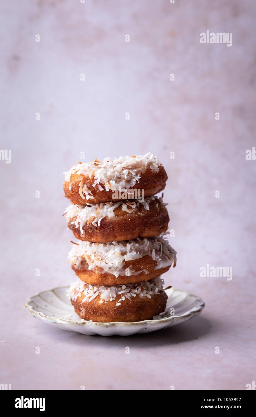 Delicious Stack of Coconut Donuts Stock Photo - Alamy