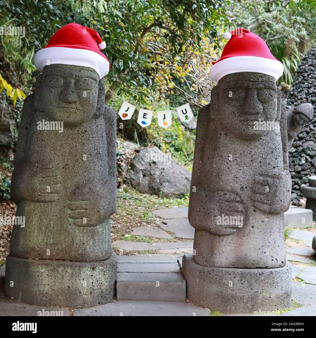 Two Korean religious statues with Christmas hats on Jeju island, South ...