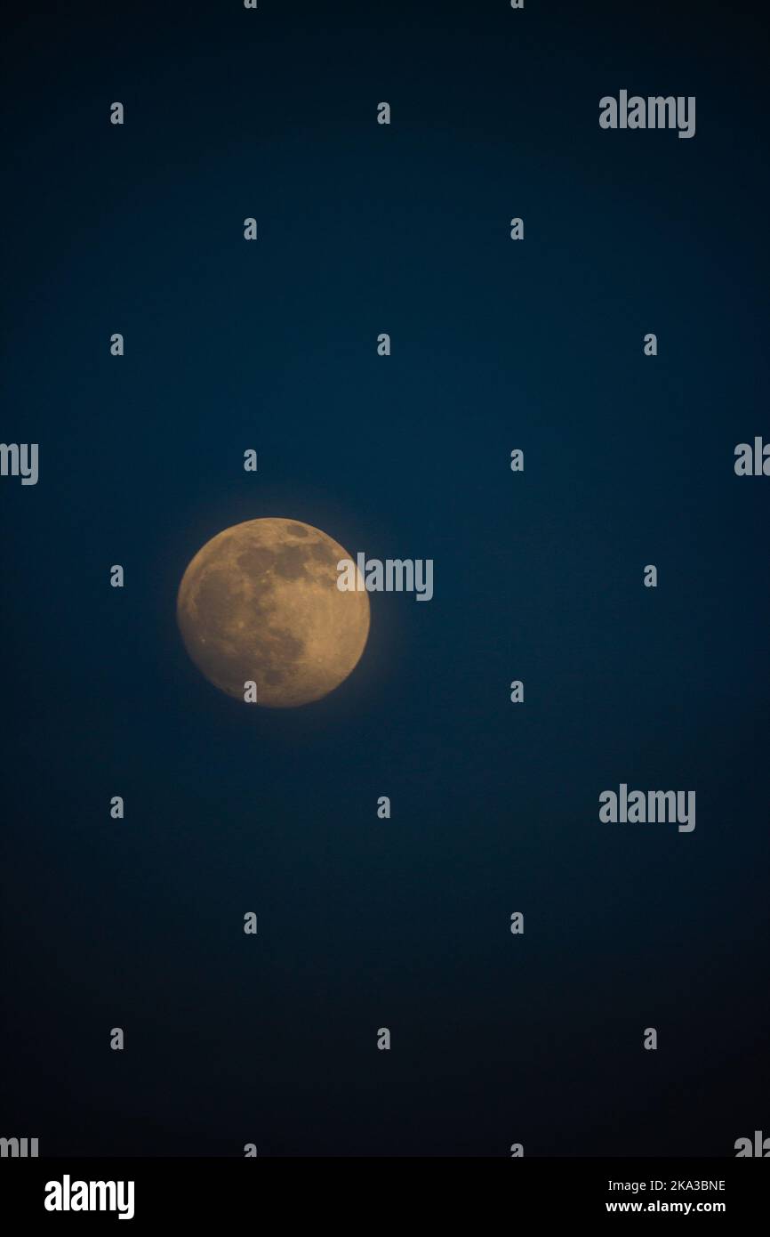 A vertical shot of the Full Moon in a night sky Stock Photo - Alamy