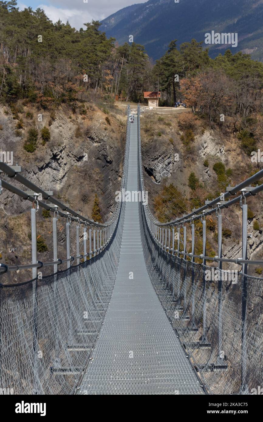 A vertical shot of the footbridge of L Ebron on the lake of Monteynard ...
