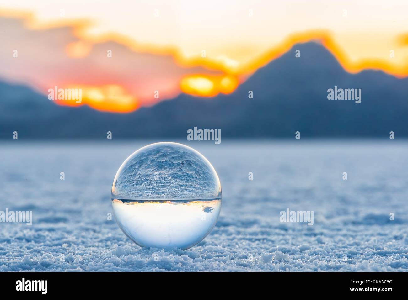 Crystal ball macro closeup ground level view of round glass globe with ...