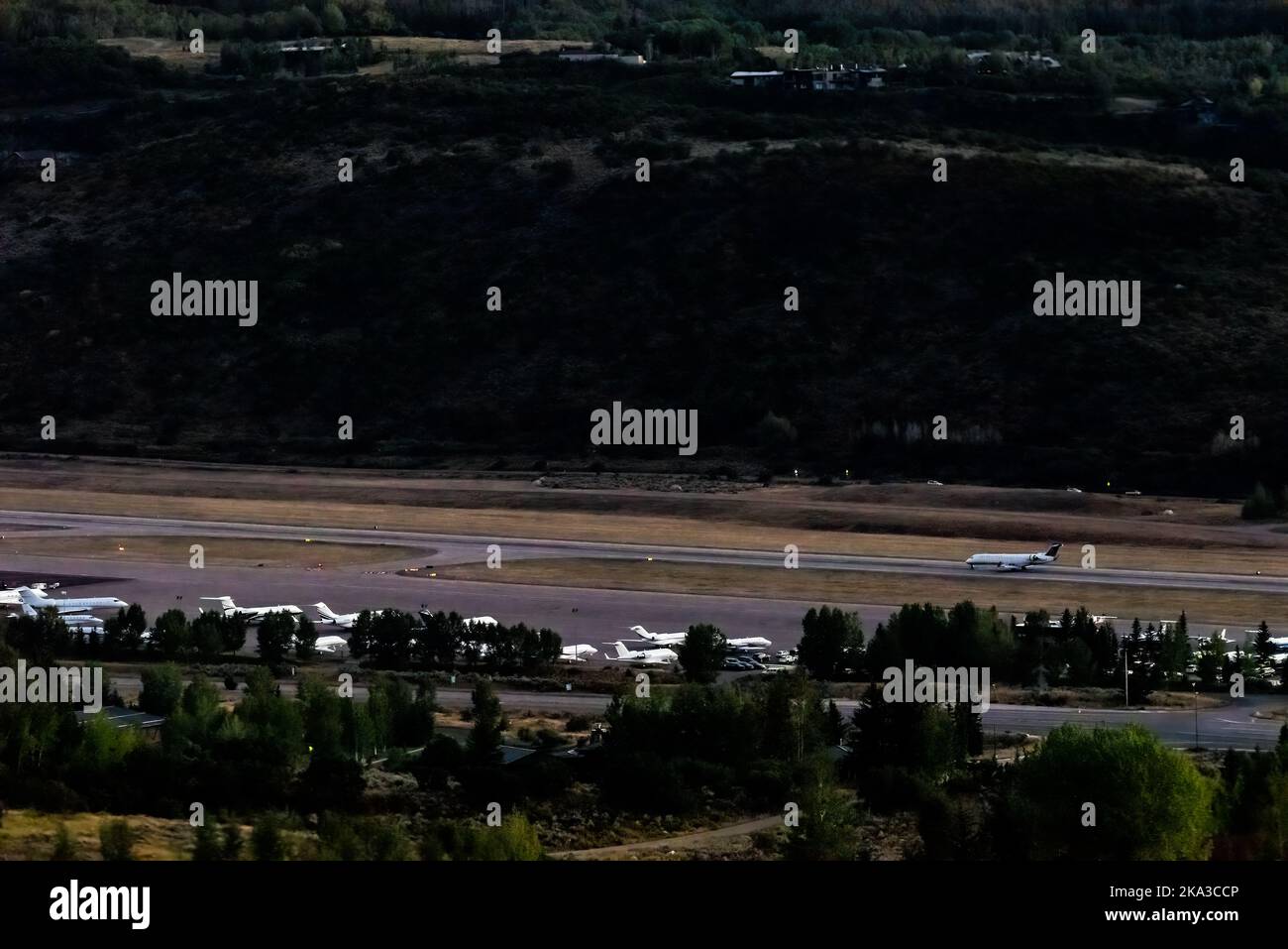 Aspen, Colorado small airport in ski resort town city at night with ...