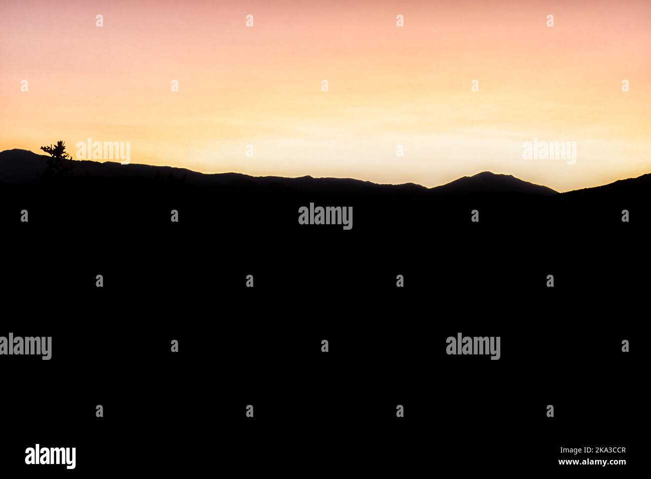 Yellow orange pastel sunset vibrant color in Aspen, Colorado with rocky ...