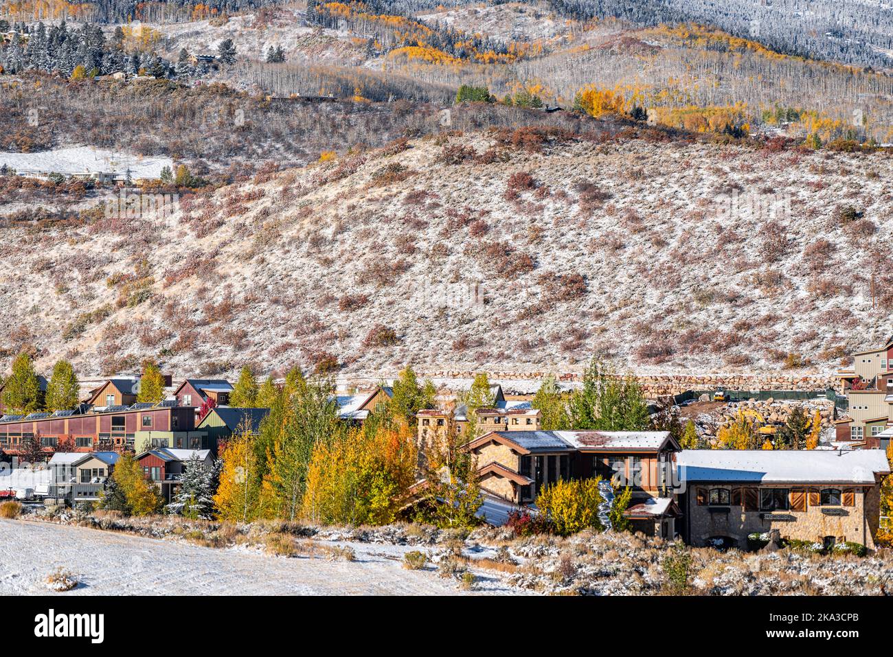 Aspen, Colorado rocky mountains with ranch farm pasture covered in snow ...