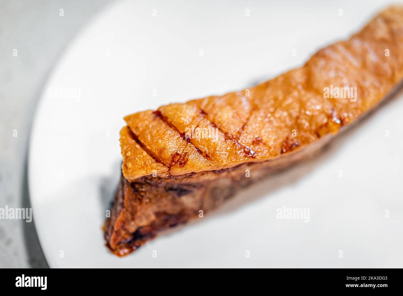 Macro closeup of fresh barbecue cooked baked pork belly fat bacon meat ...