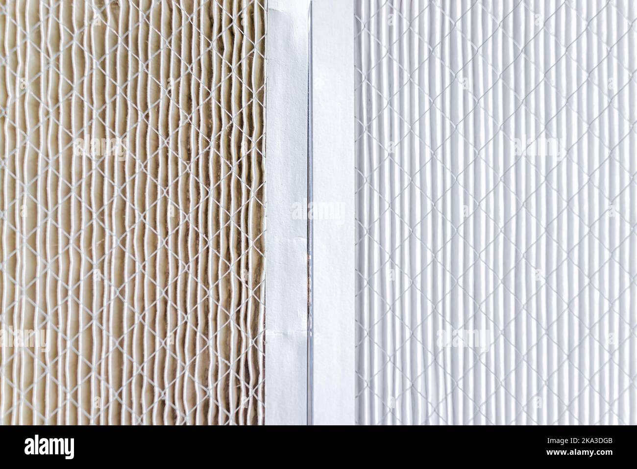 Macro closeup of side by side comparison of two dirty and clean AC air ...