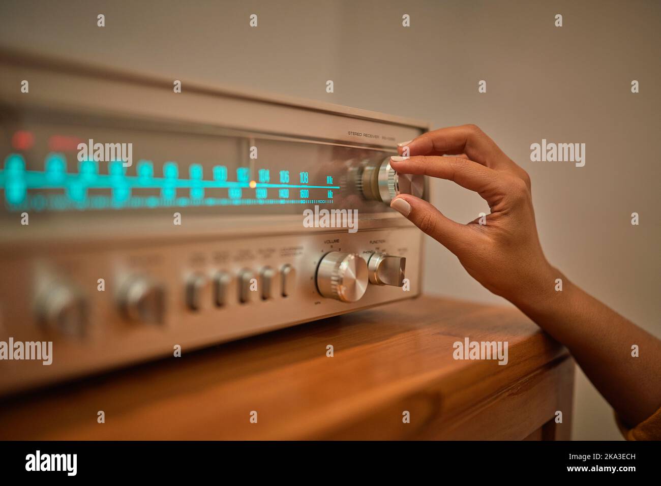 Cropped unrecognizable female changing sound volume on old fashioned ...