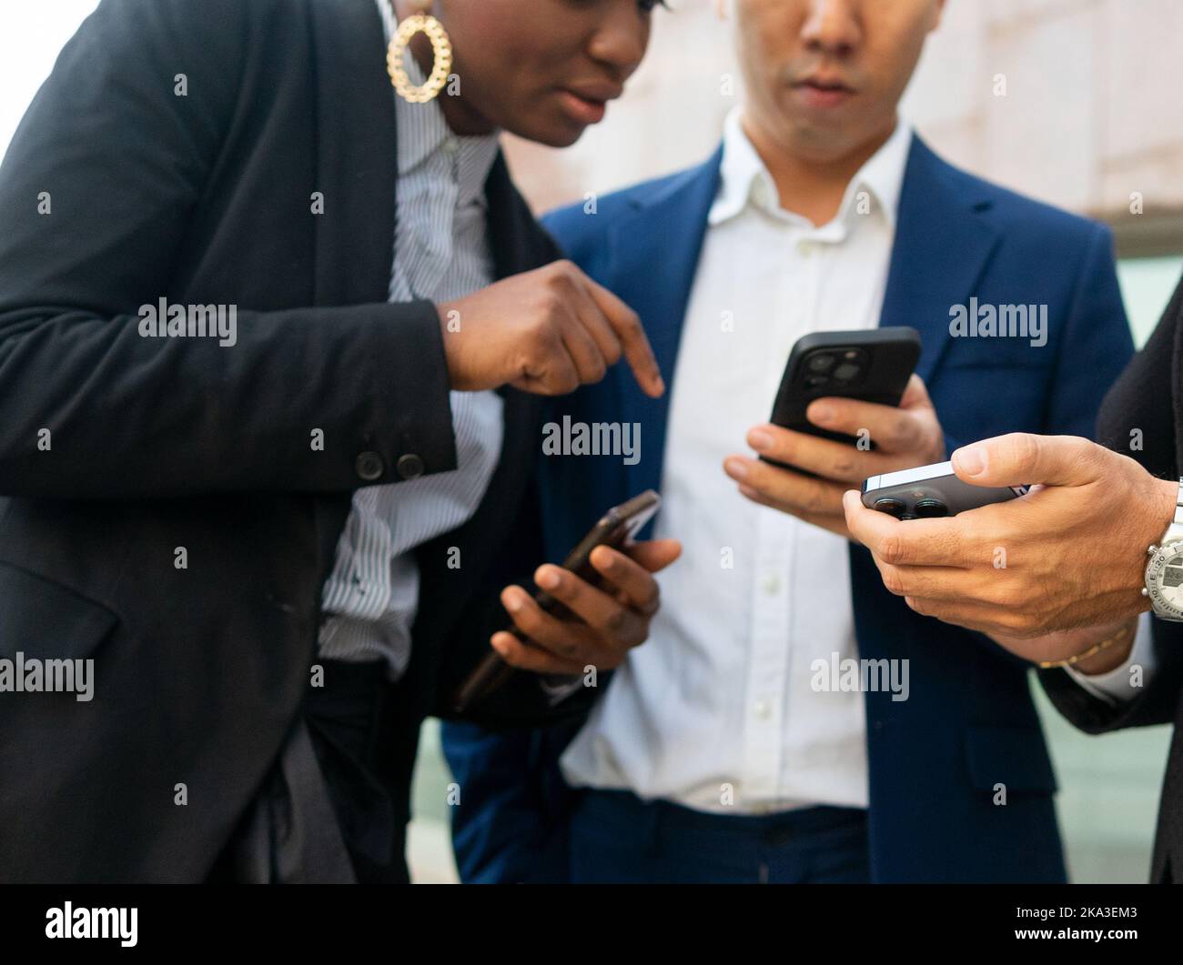 Low angle of crop anonymous multiracial businesspeople in formal suits ...