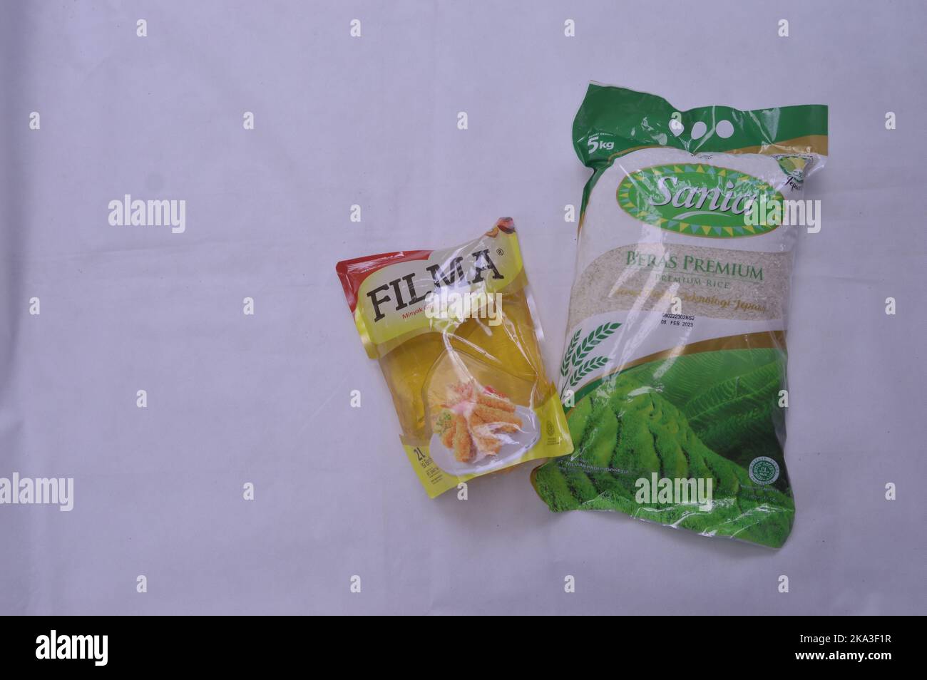 Packaged rice and cooking oil on a white background Stock Photo - Alamy