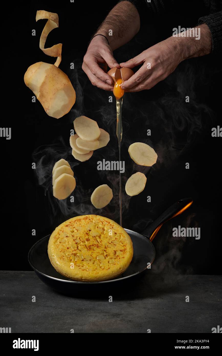 Hand dropping egg hi-res stock photography and images - Alamy