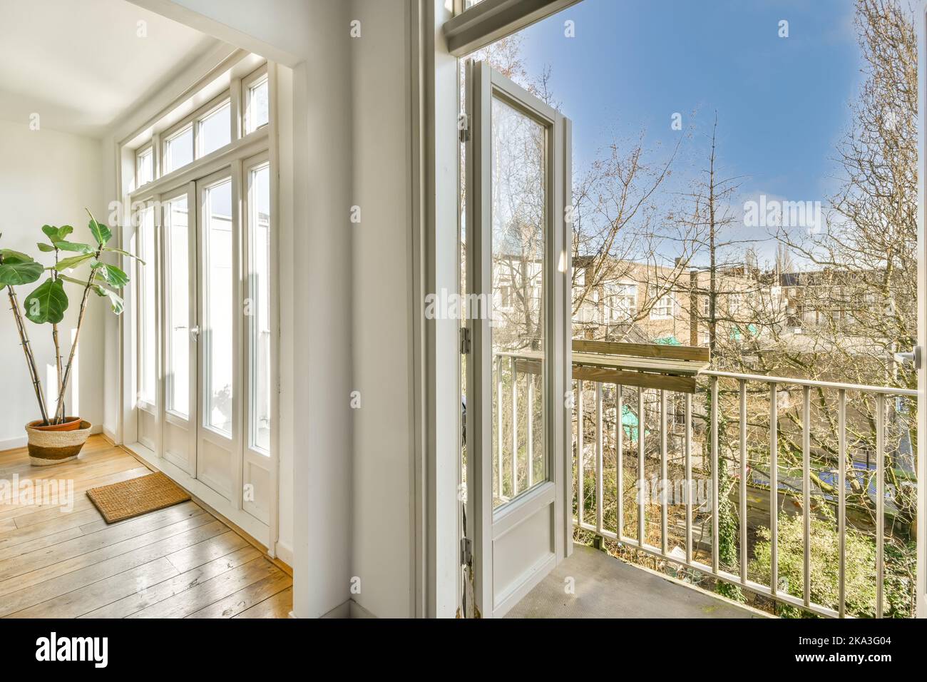 Interior of balcony with big glass windows and railing in room with ...