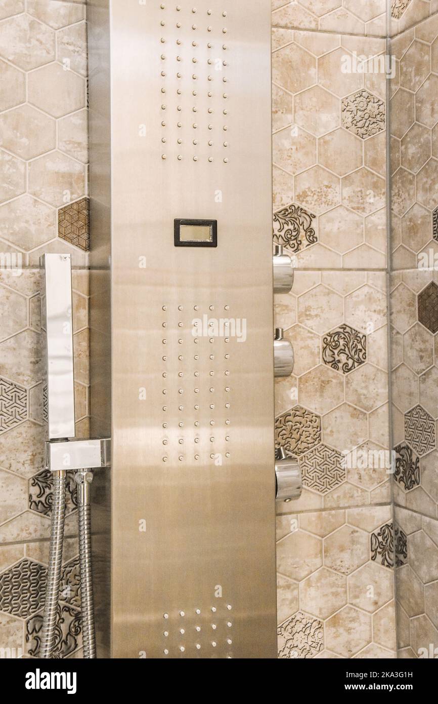 Shower box in modern bathroom with brown tiled walls Stock Photo - Alamy