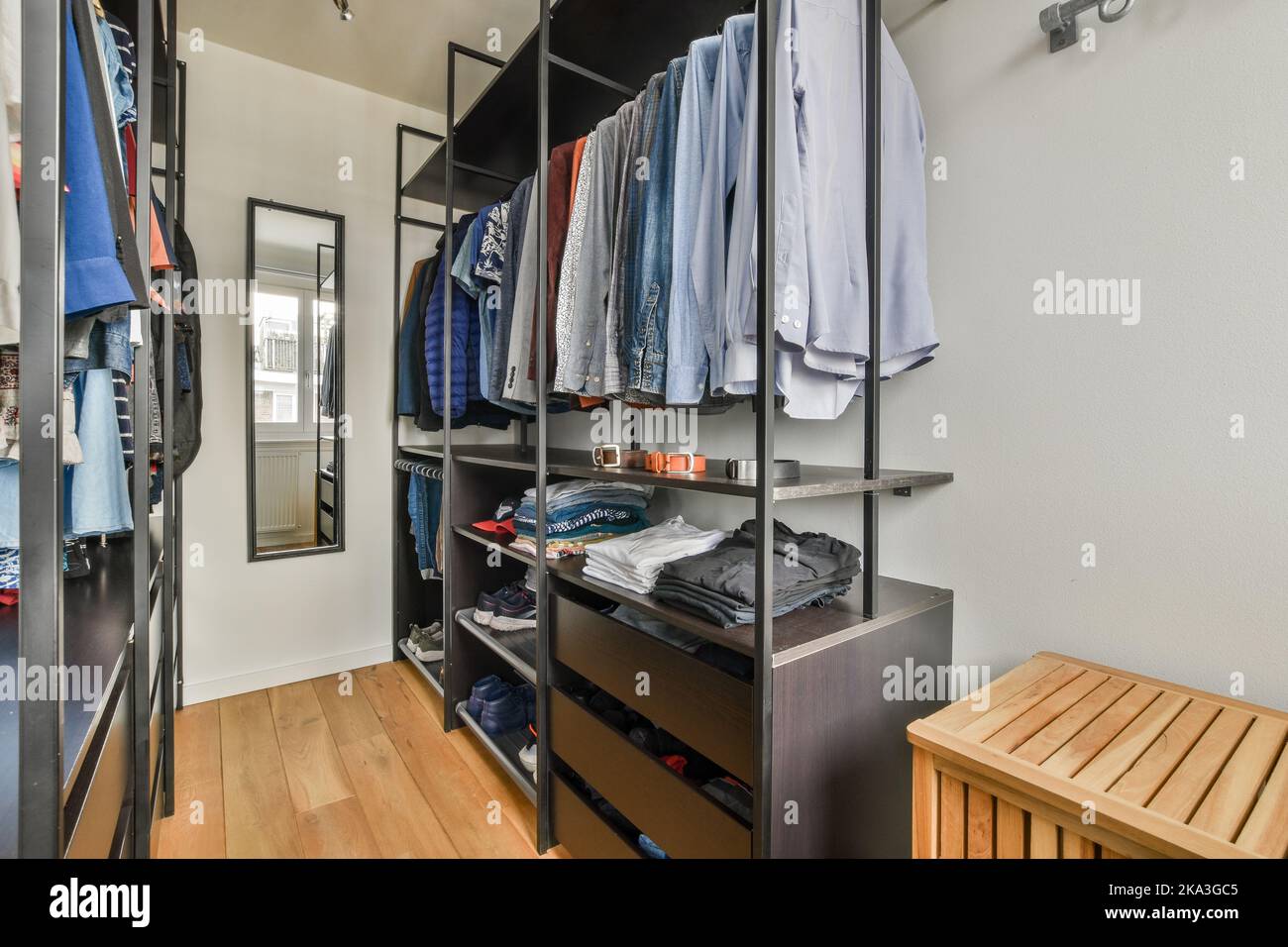 Interior of a dressing room of a modern house with clean and folded ...