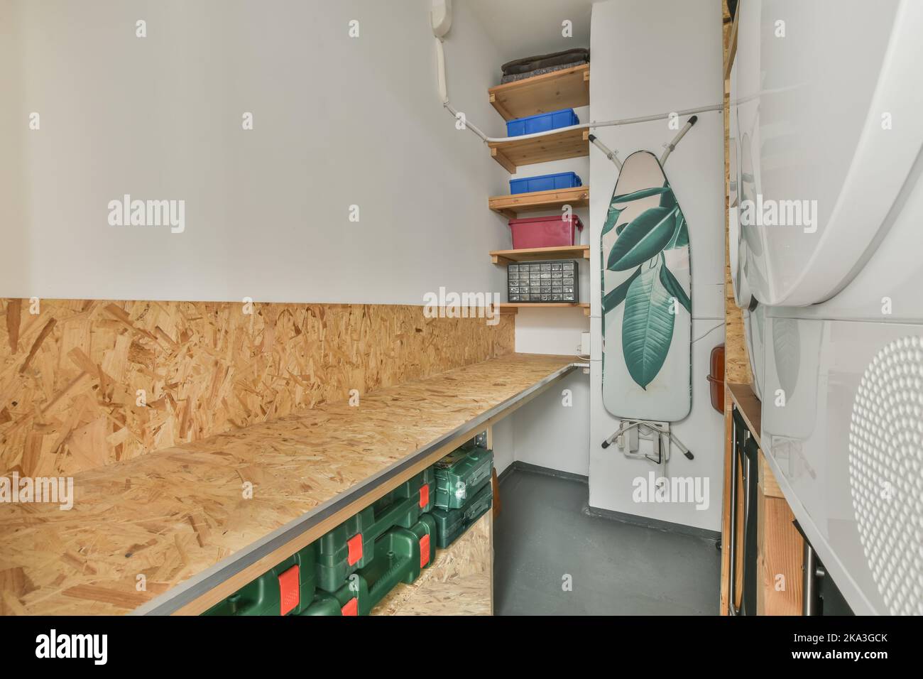 Storage room next to a wood table and shelving on white walls Stock ...