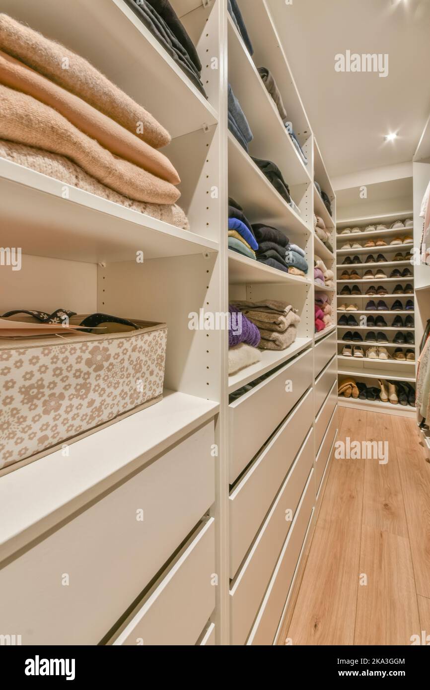 Interior of a dressing room of a modern house with clean and folded ...