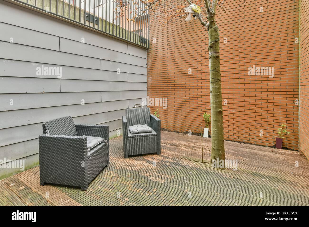 Terrace of residential building with comfortable seat in pavement in ...