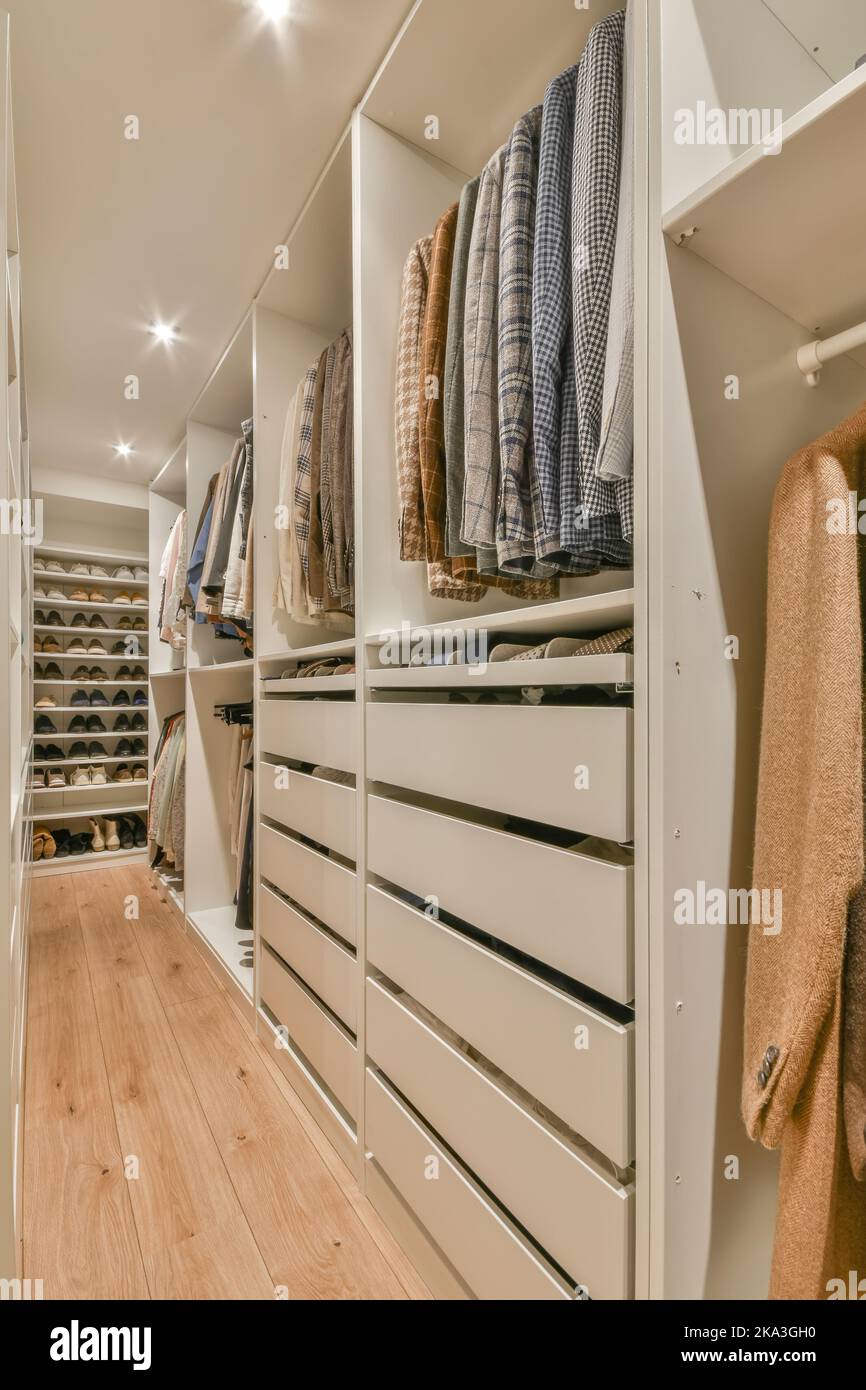 Interior of a dressing room of a modern house with clean and folded ...
