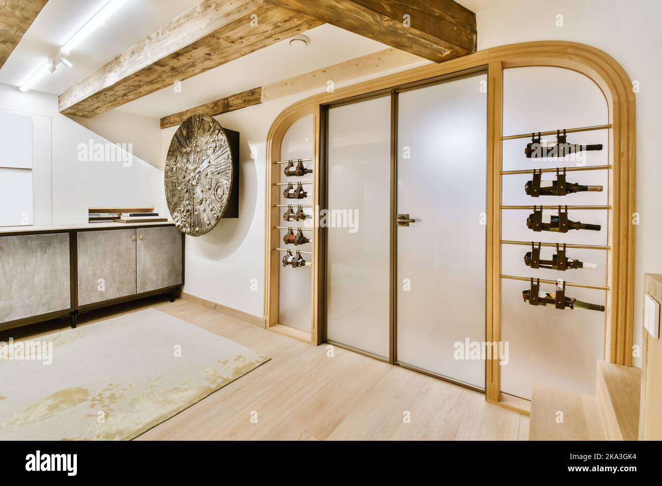 Collection of bottles with various wine hanging from leather belts on ...